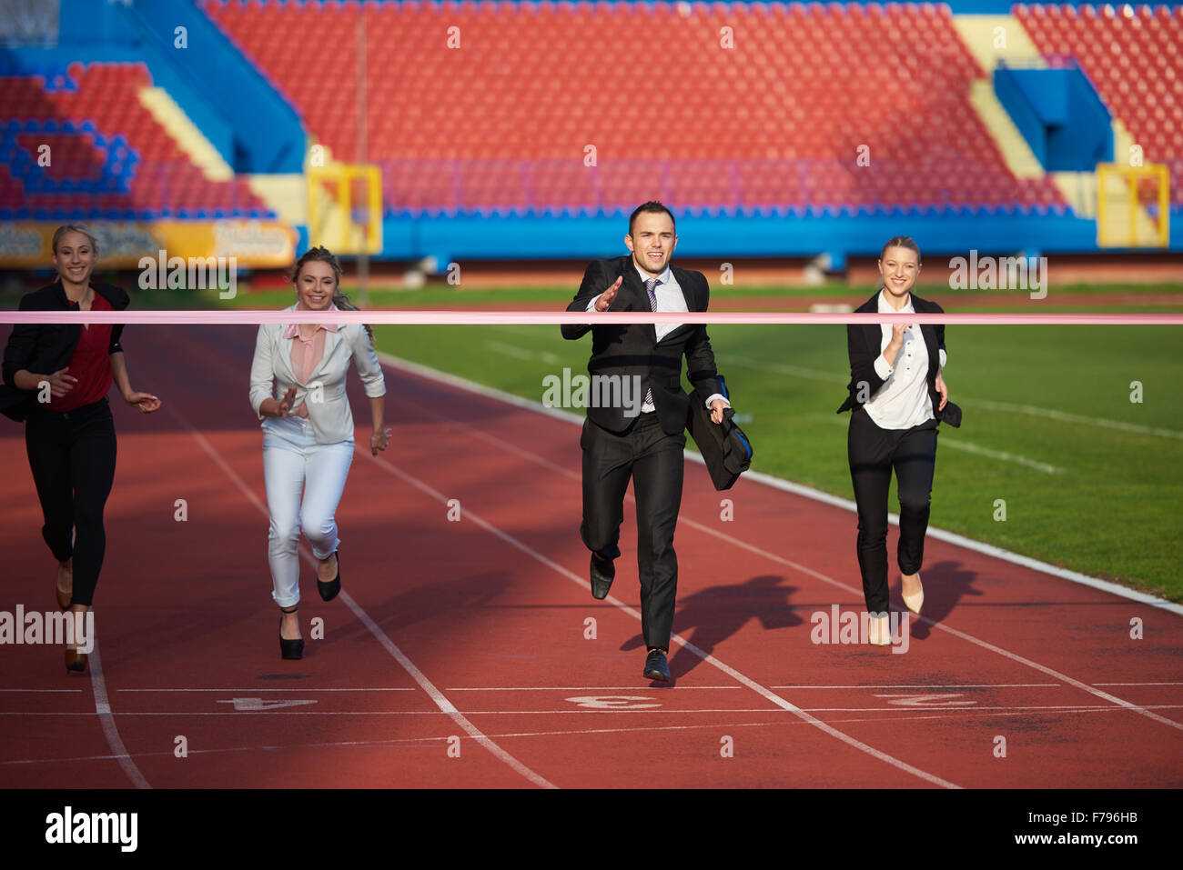 business people running together on racing track Stock Photo - Alamy