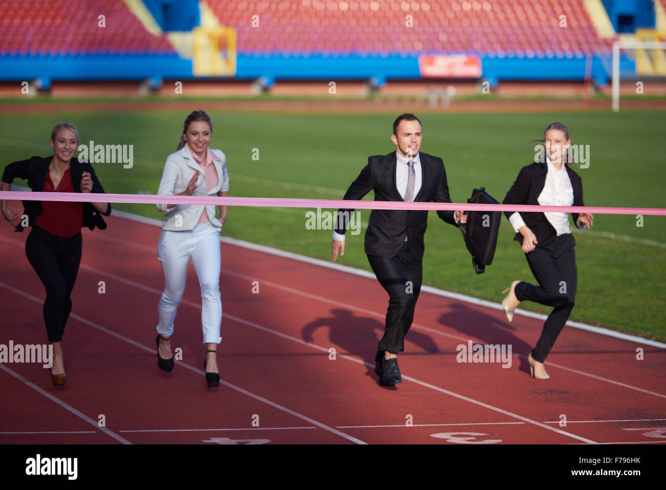 business people running together on athletics racing track Stock Photo ...