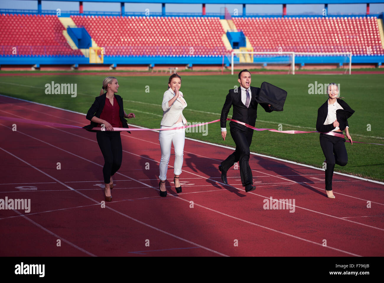 business people running together on racing track Stock Photo - Alamy