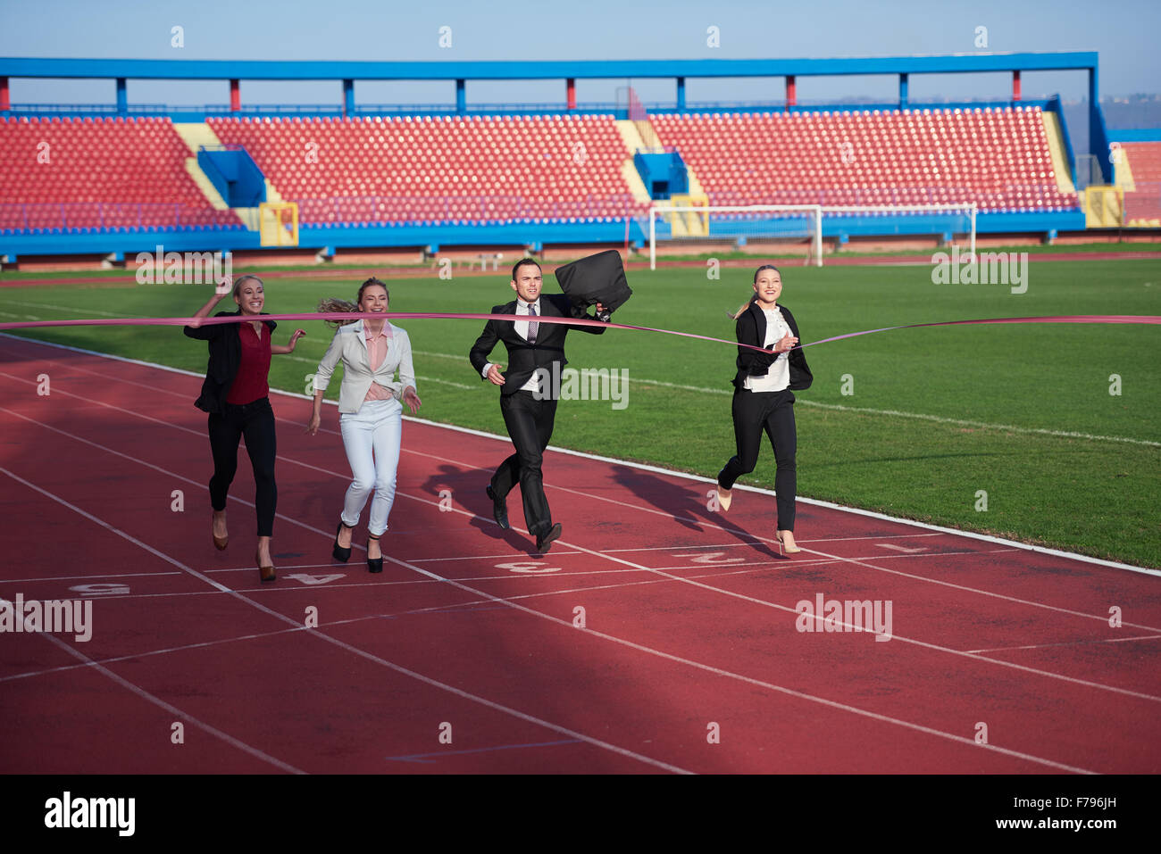 business people running together on racing track Stock Photo - Alamy