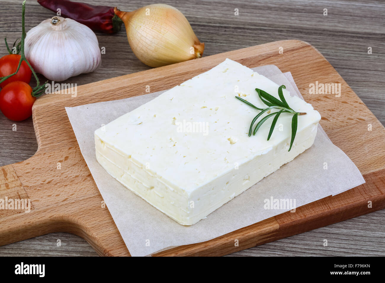 Traditional Caucasian homemade Cheese Brinza with rosemary on wood ...