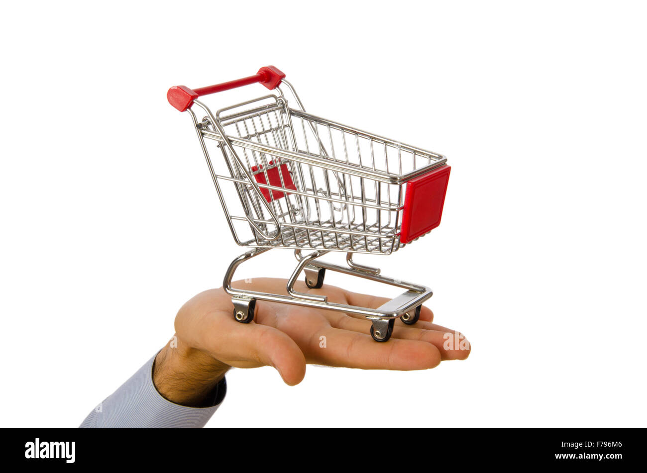 Hand holding shopping cart on white Stock Photo - Alamy