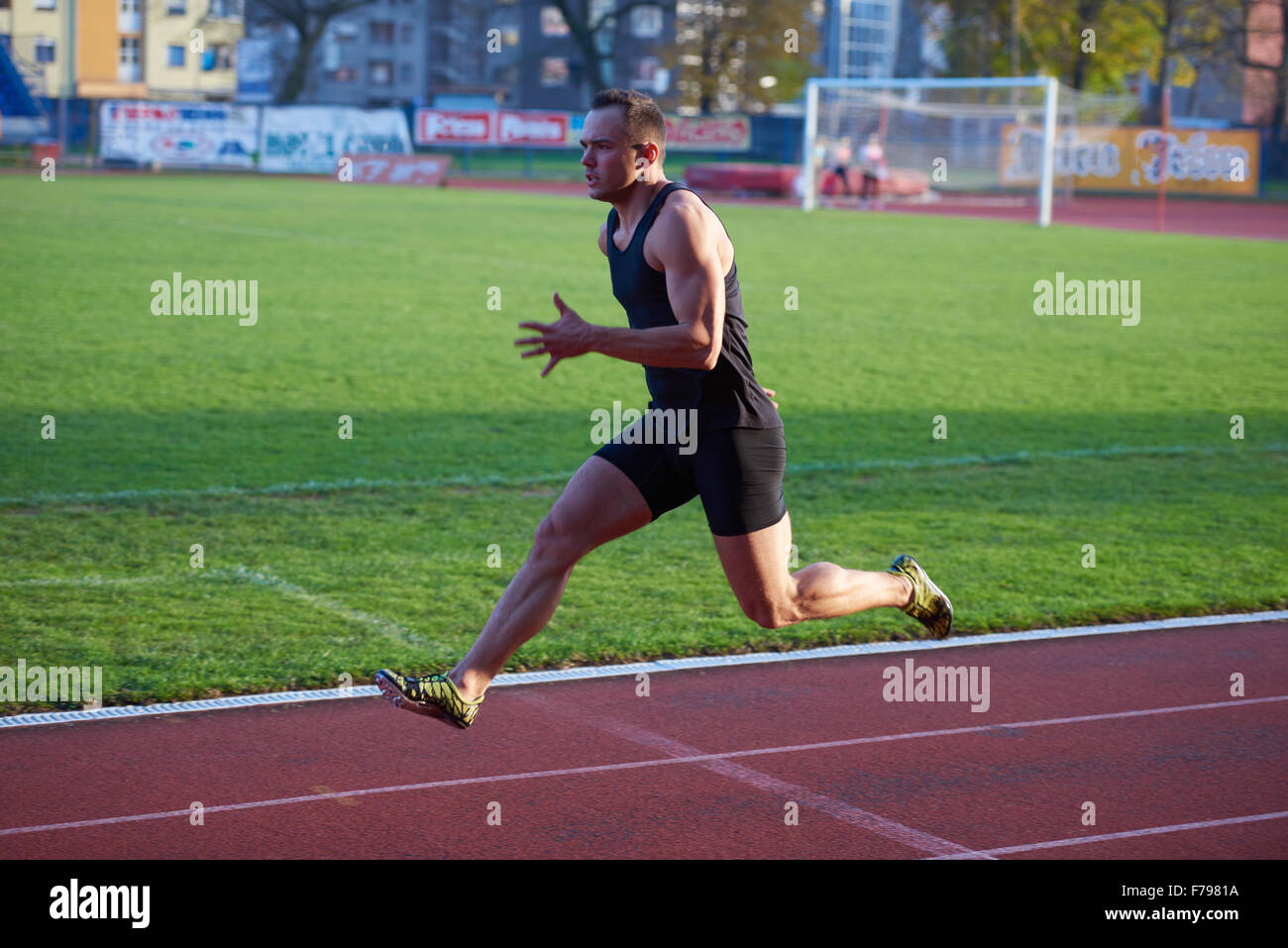 Sprinter leaving starting blocks on the running track. Explosive start ...
