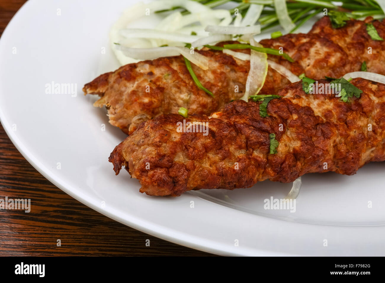Hot Beef kebab with onion rings and rosemary Stock Photo - Alamy