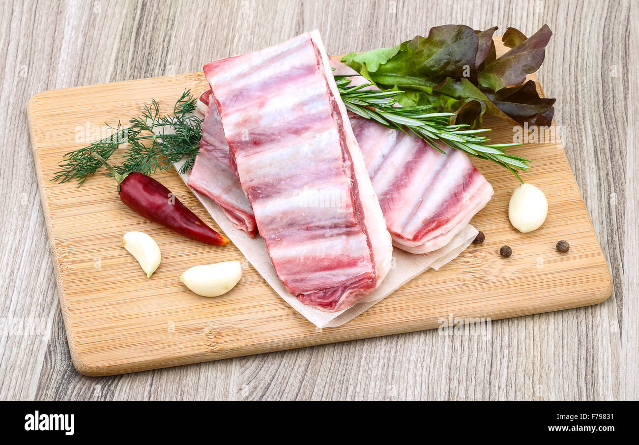 Fresh cold Raw lamb ribs with garlik and pepper - ready for cooking ...