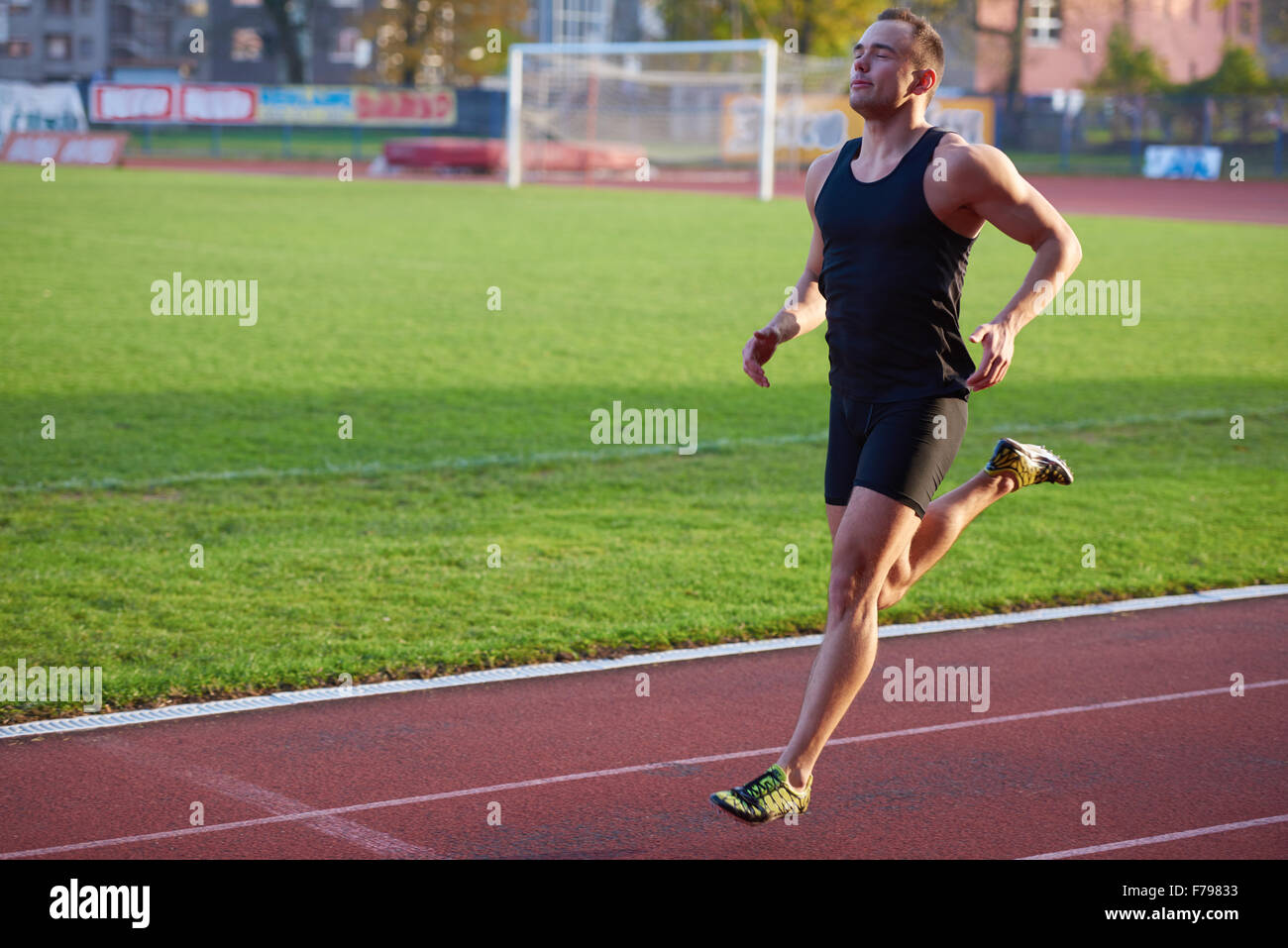 Sprinter leaving starting blocks on the running track. Explosive start ...