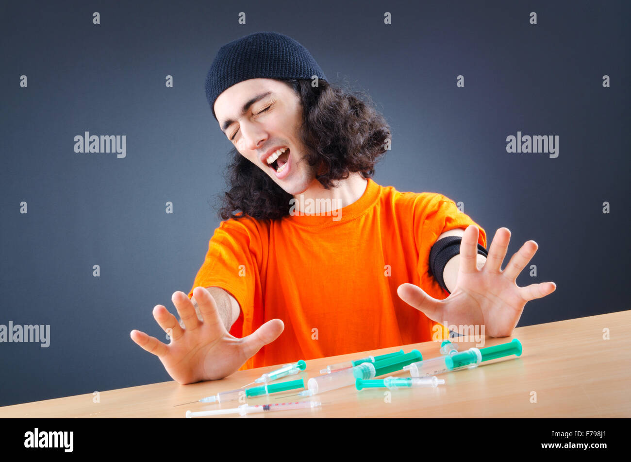 Young druc addict with syringe Stock Photo - Alamy
