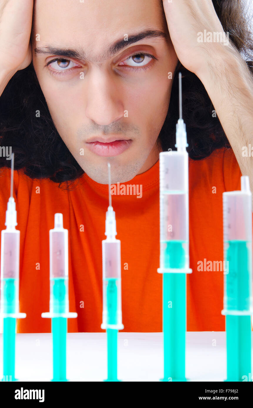 Young druc addict with syringe Stock Photo - Alamy
