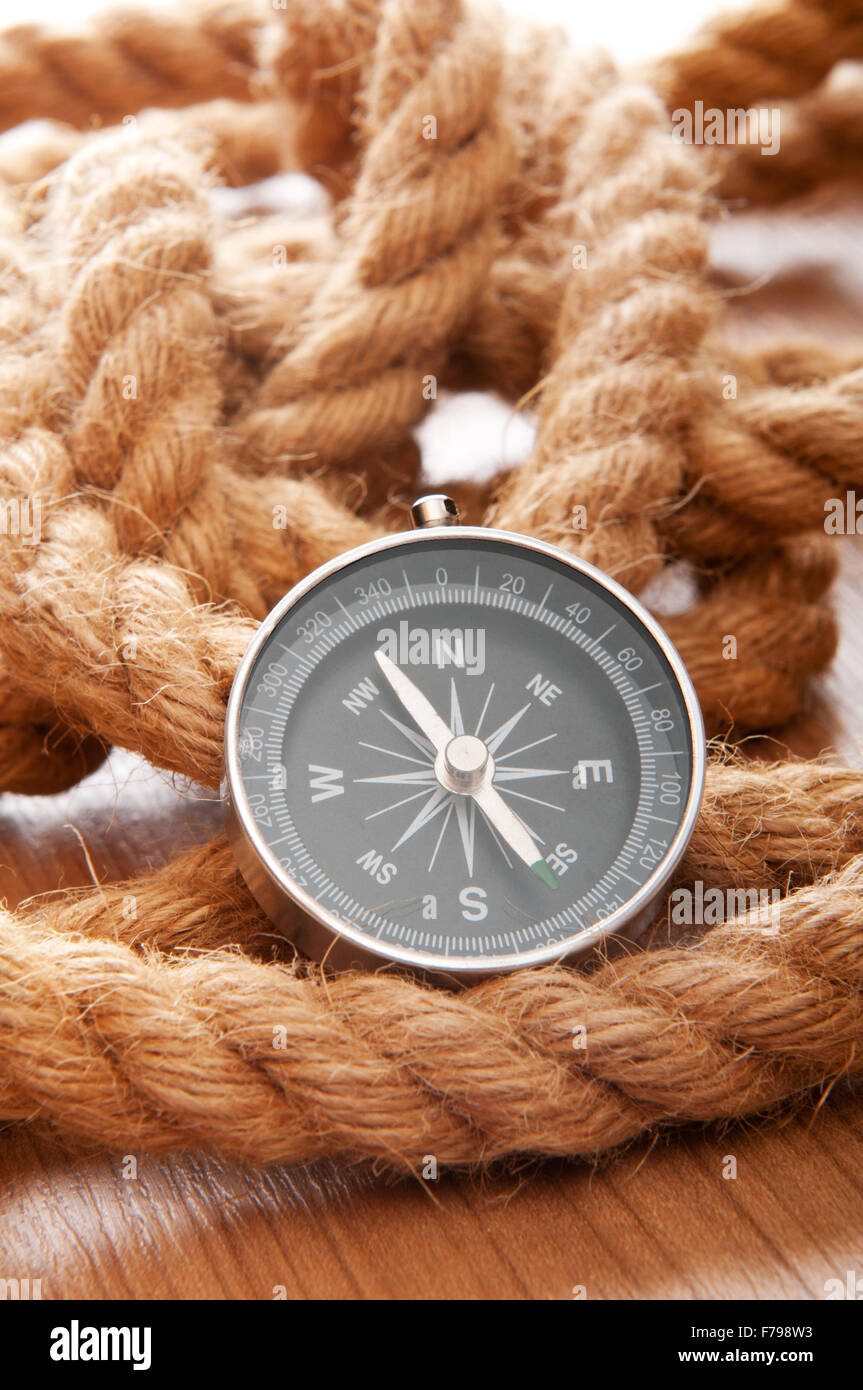 Compass and rope in travel and adventure concept Stock Photo - Alamy
