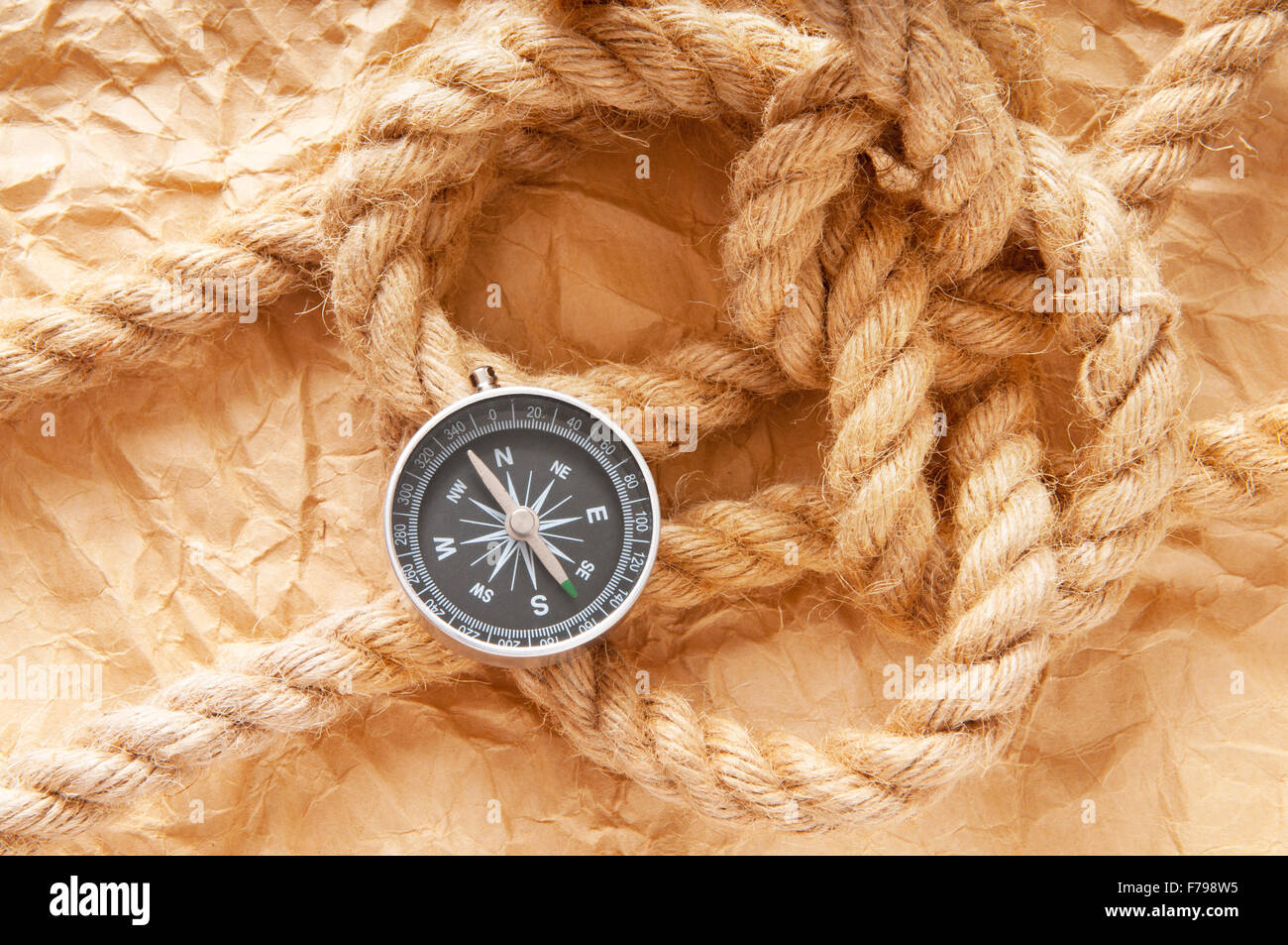 Compass and rope in travel and adventure concept Stock Photo - Alamy