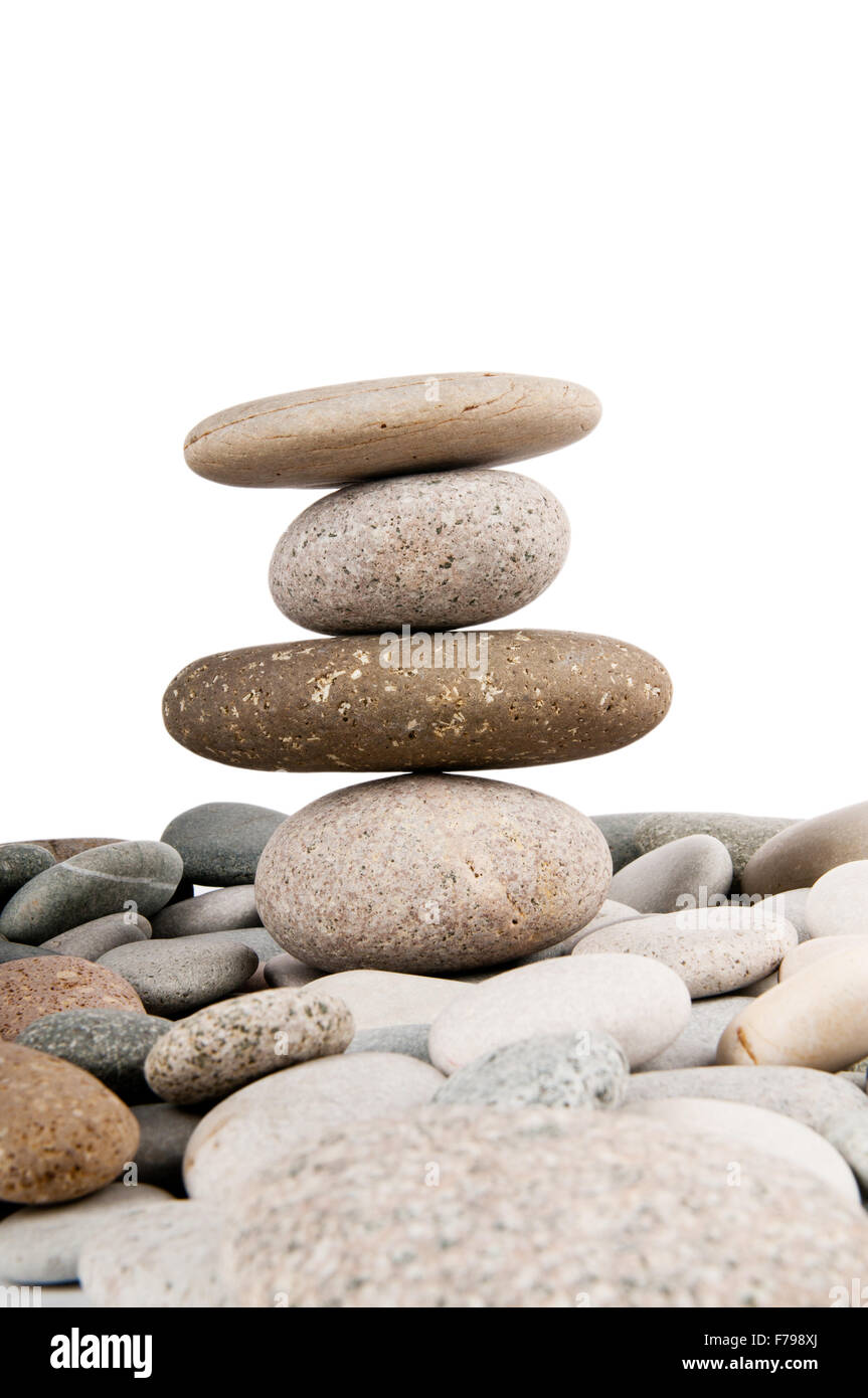 Stack of pebbles isolated on the white Stock Photo - Alamy