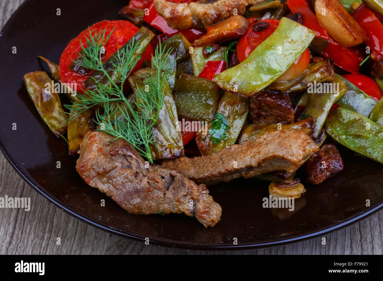 Asian cuisine - Stir fried pork with vegetables Stock Photo - Alamy