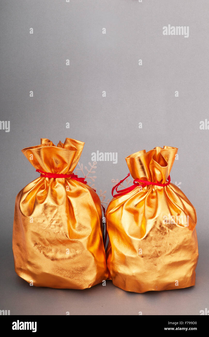 Golden sacks full of something good Stock Photo - Alamy