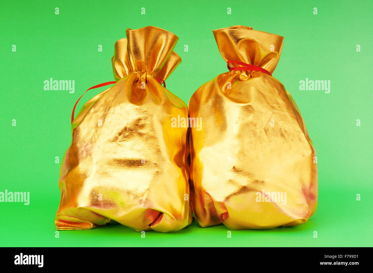 Golden sacks full of something good Stock Photo - Alamy