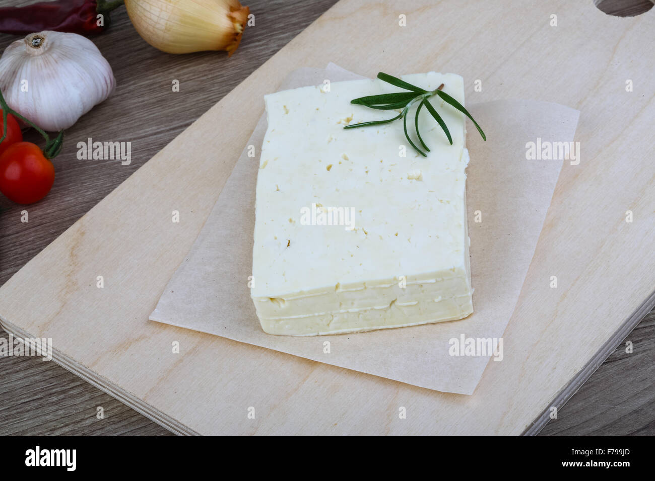 Traditional Caucasian homemade Cheese Brinza with rosemary on wood ...