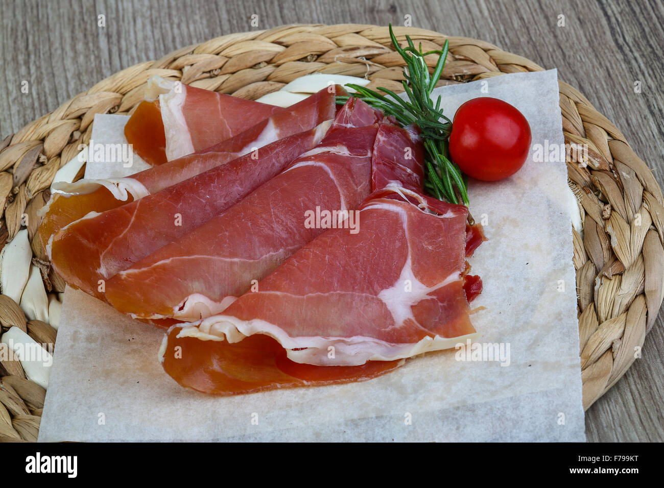 Spanish traditional snack - Jamon with tomato and rosemary Stock Photo ...