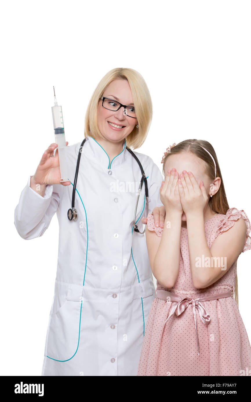 mad Doctor doing vaccine injection to a child. huge syringe. Isolated ...