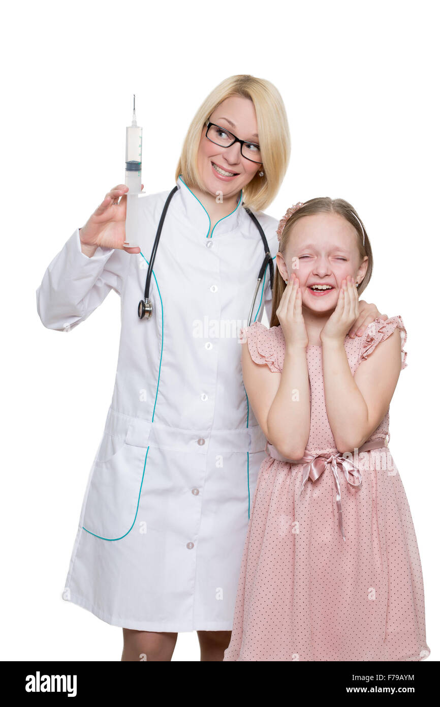 mad Doctor doing vaccine injection to a child. huge syringe. Isolated ...