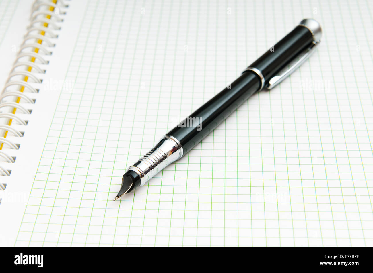 Writing pen on the blank page Stock Photo - Alamy