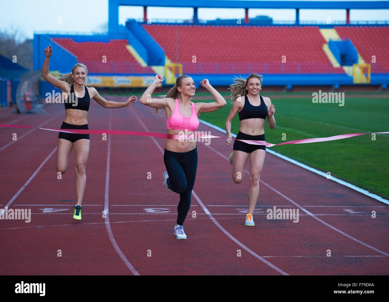 Female Runners Finishing athletic Race Together Stock Photo - Alamy