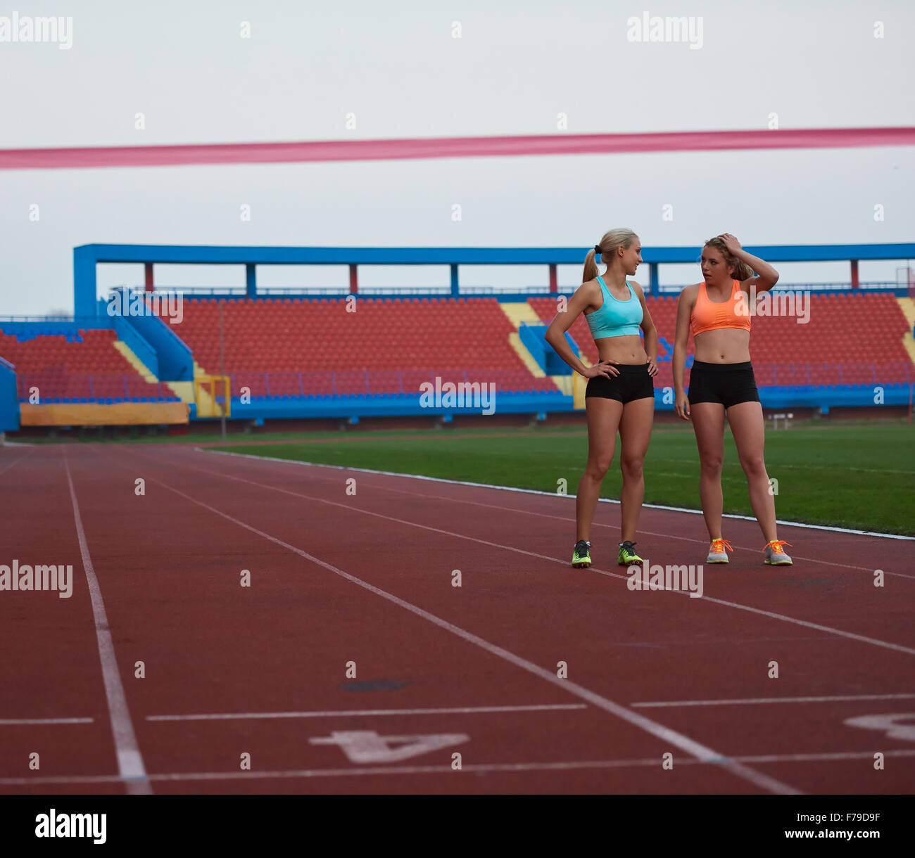 Female Runners Finishing athletic Race Together Stock Photo - Alamy