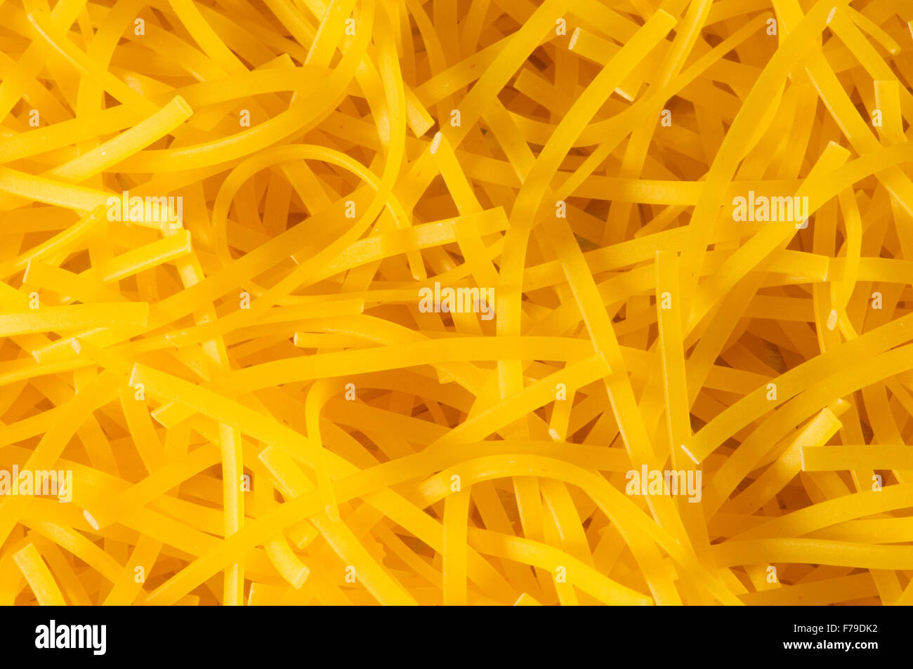 Extreme close up of yellow italian pasta Stock Photo - Alamy