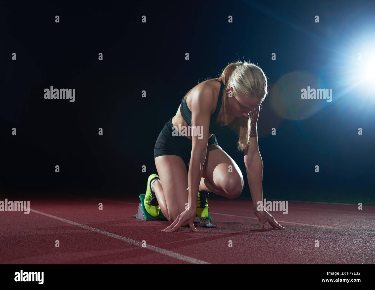 Female sprinter leaving starting blocks hi-res stock photography and ...