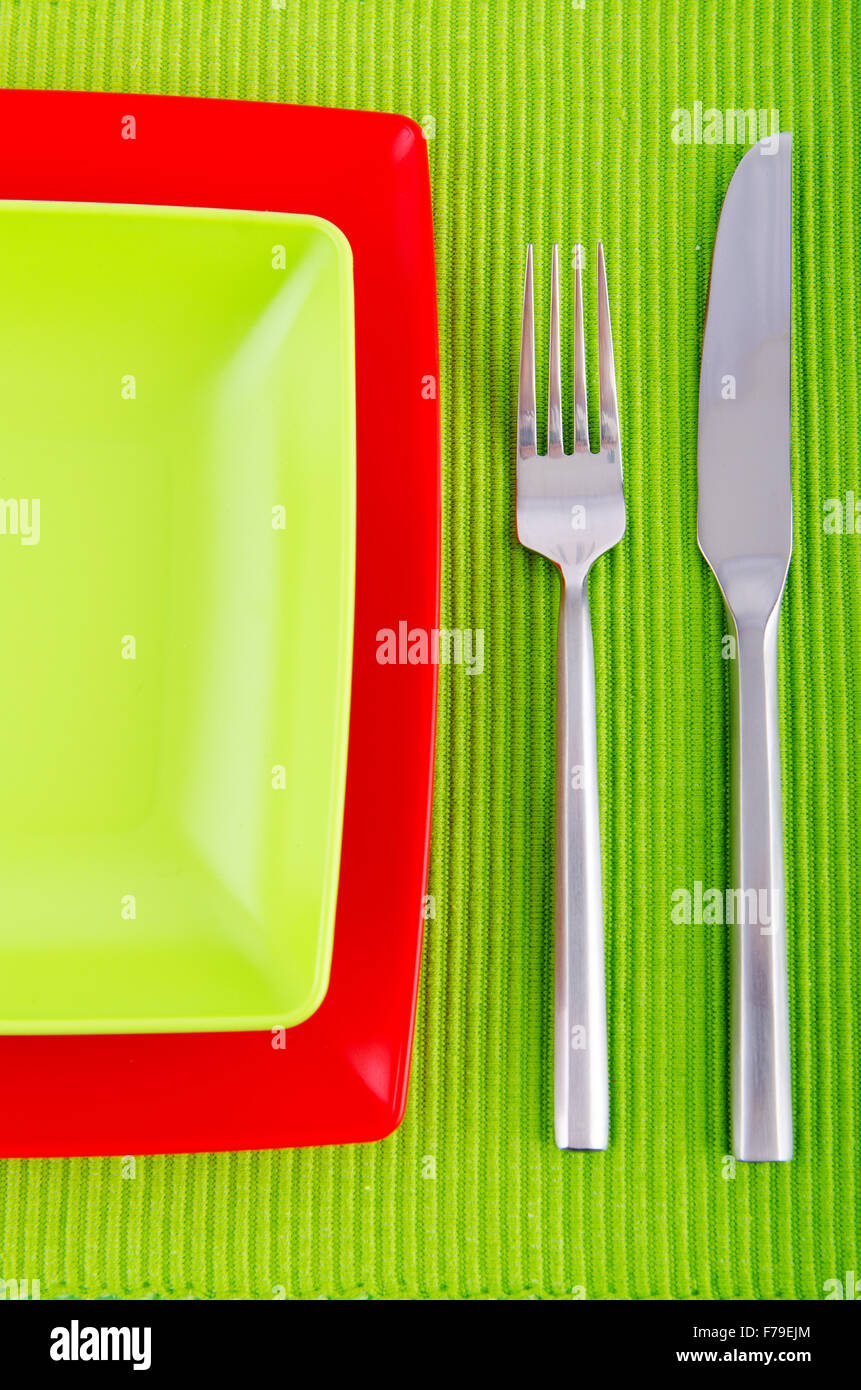 Empty plate with utensils Stock Photo - Alamy