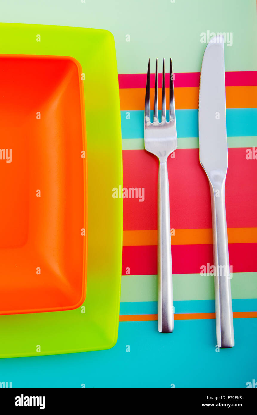 Empty plate with utensils Stock Photo - Alamy