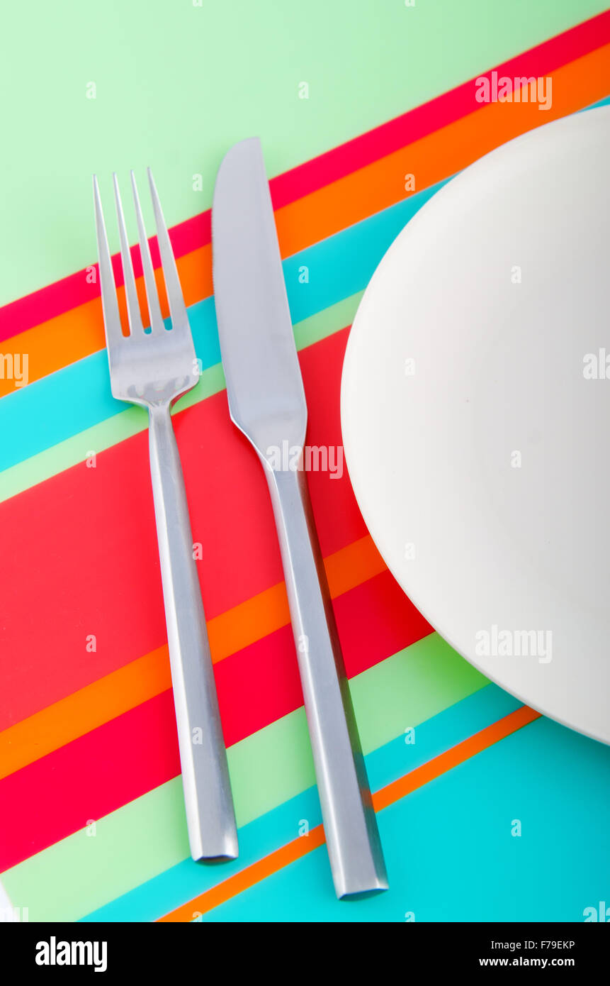 Empty plate with utensils Stock Photo - Alamy