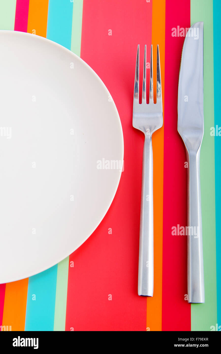 Empty plate with utensils Stock Photo - Alamy