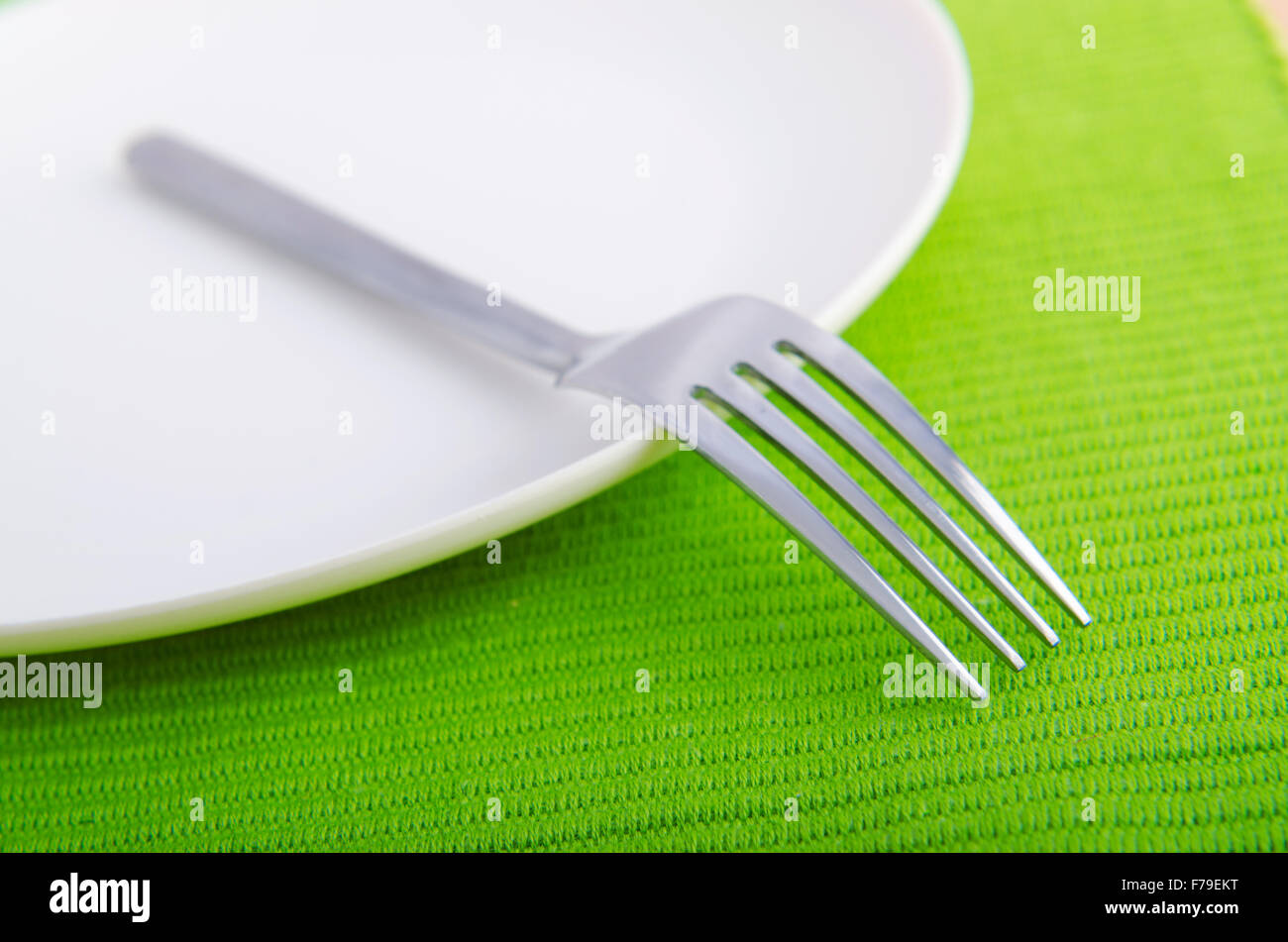 Empty plate with utensils Stock Photo - Alamy