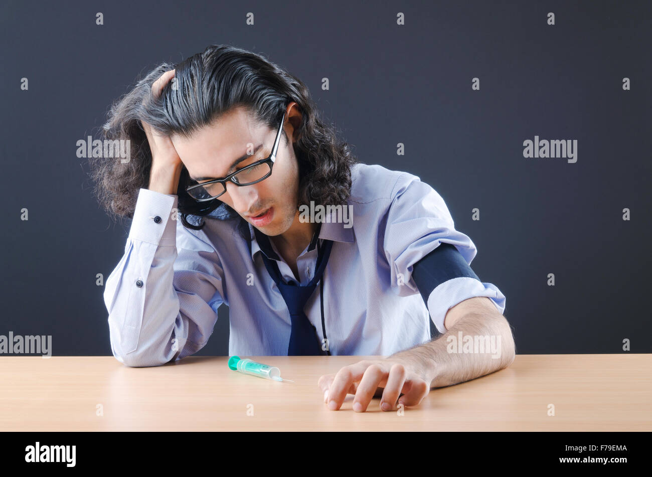 Young druc addict with syringe Stock Photo - Alamy