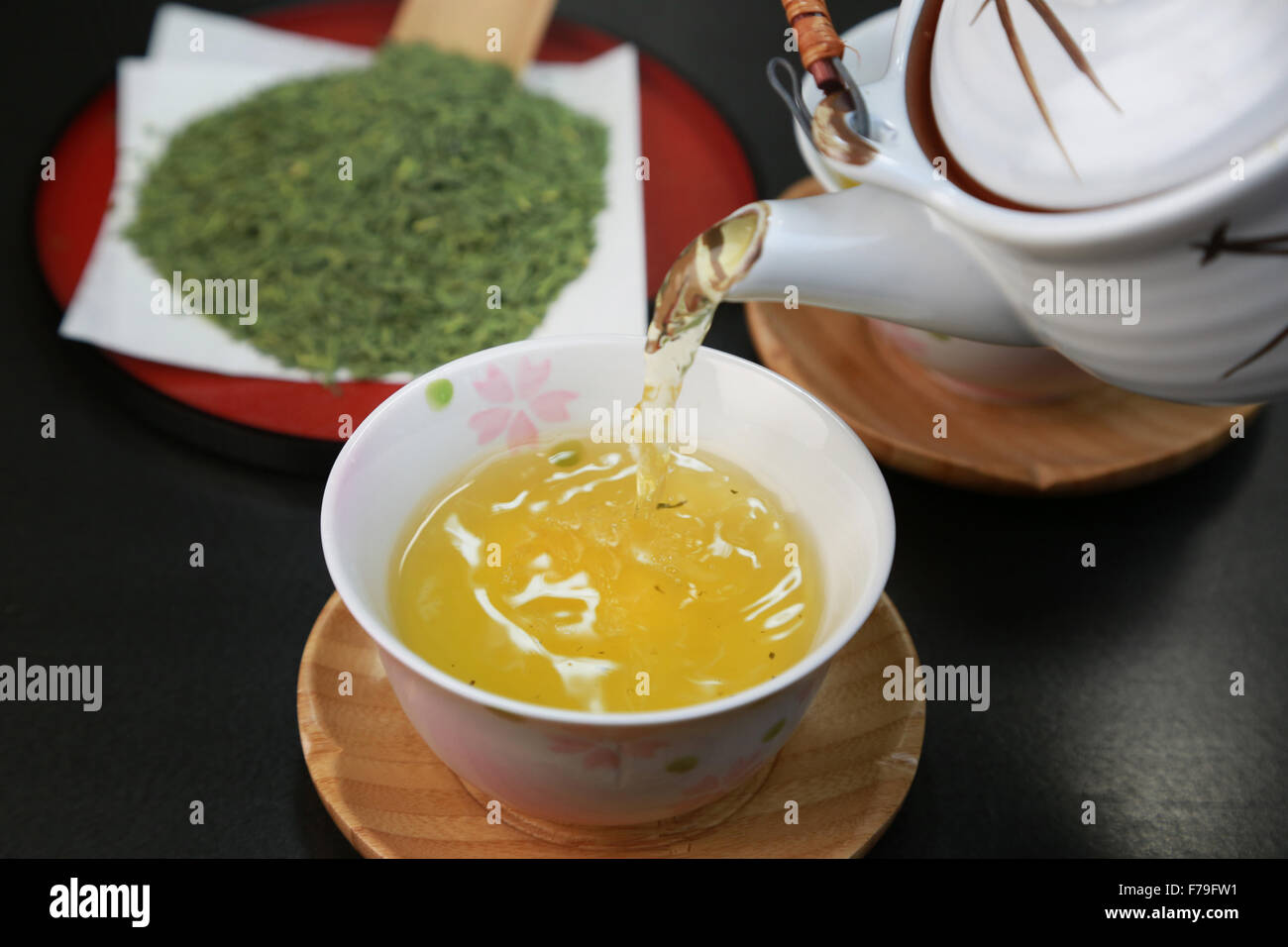 Japanese hot tea being poured into a cup Stock Photo - Alamy