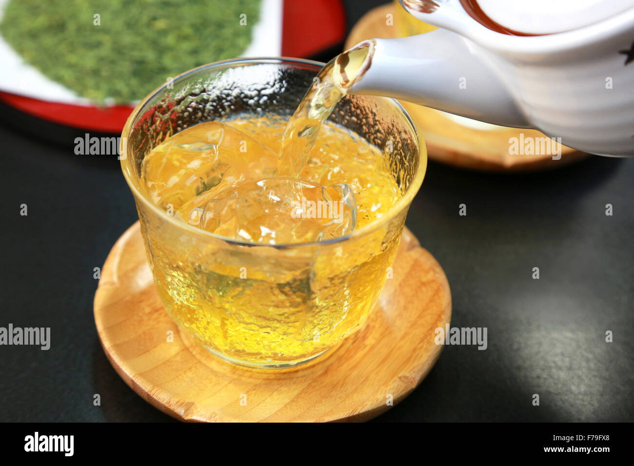 Tea being poured into a tea cup hi-res stock photography and images - Alamy