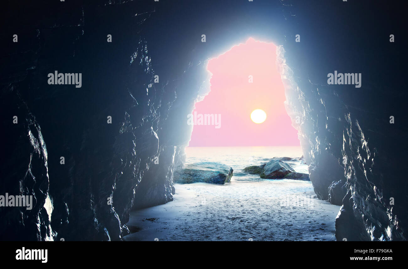 Natural arch at beach in summer sunset Stock Photo - Alamy