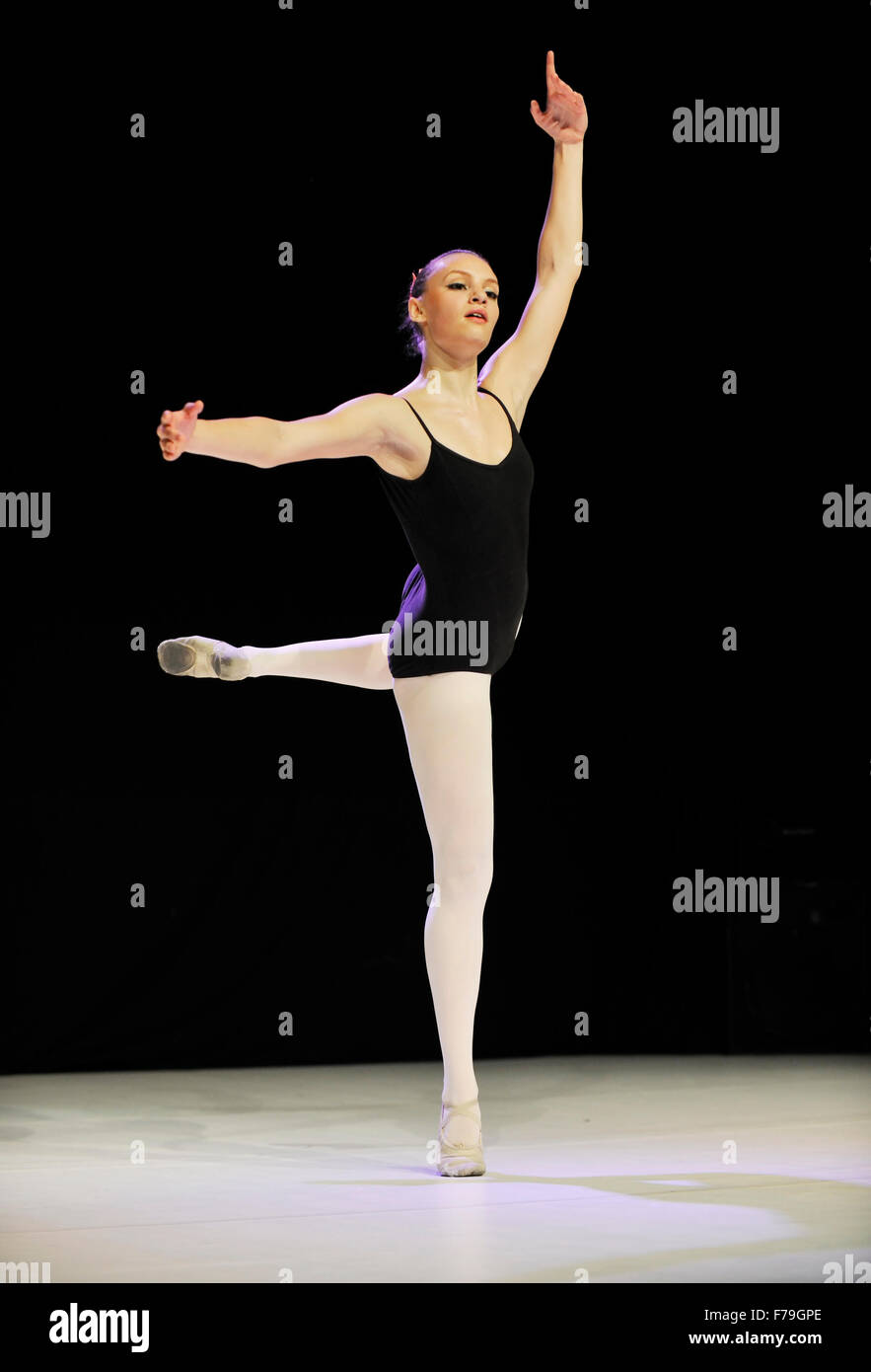 young happy ballet girl ballerina perform dance on stage at ballet ...