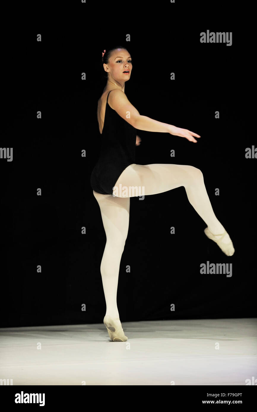 young happy ballet girl ballerina perform dance on stage at ballet ...