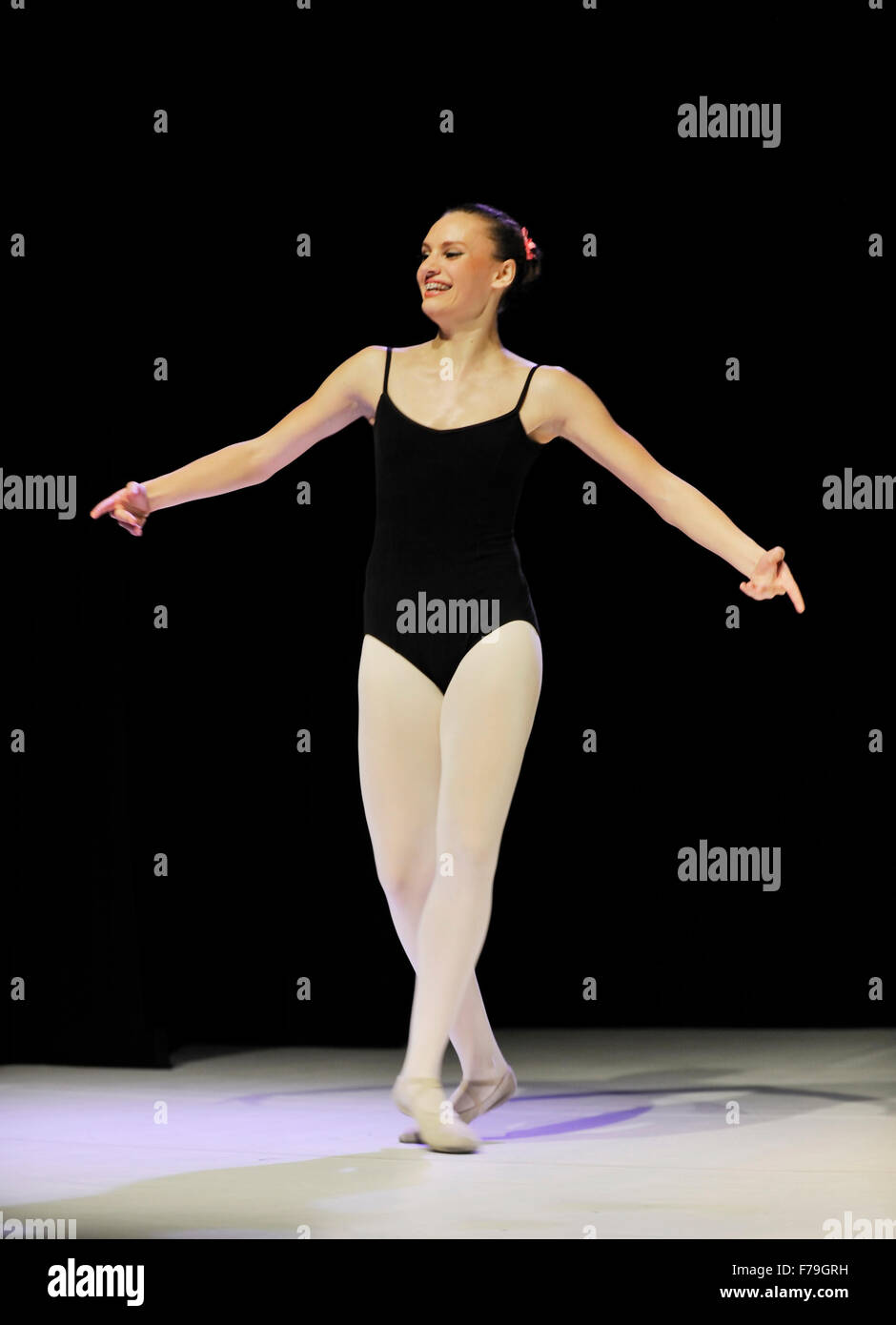 young happy ballet girl ballerina perform dance on stage at ballet ...