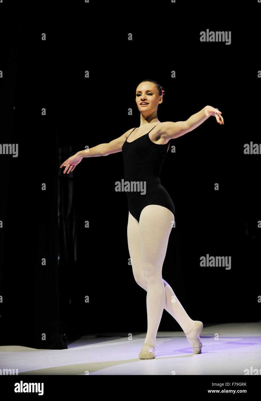young happy ballet girl ballerina perform dance on stage at ballet ...