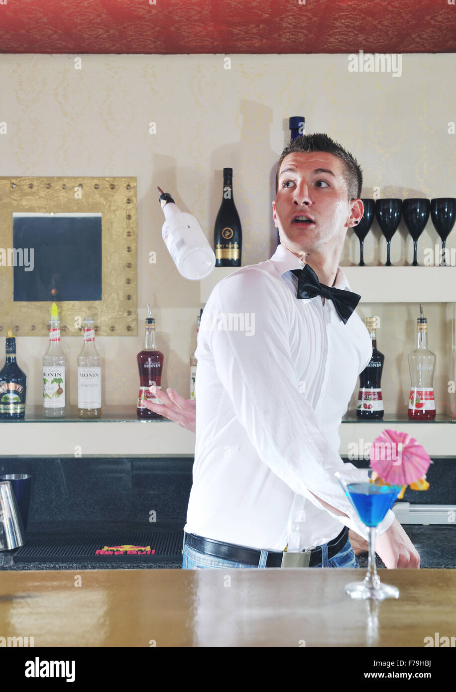 pro barman prepare coctail drink and representing nightlife and party ...