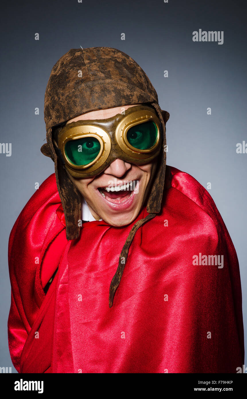 Funny pilot with goggles and helmet Stock Photo - Alamy