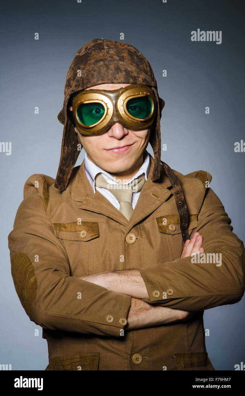 Funny pilot with goggles and helmet Stock Photo - Alamy