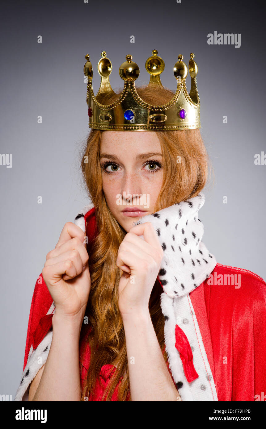 Queen in red dress in studio Stock Photo - Alamy