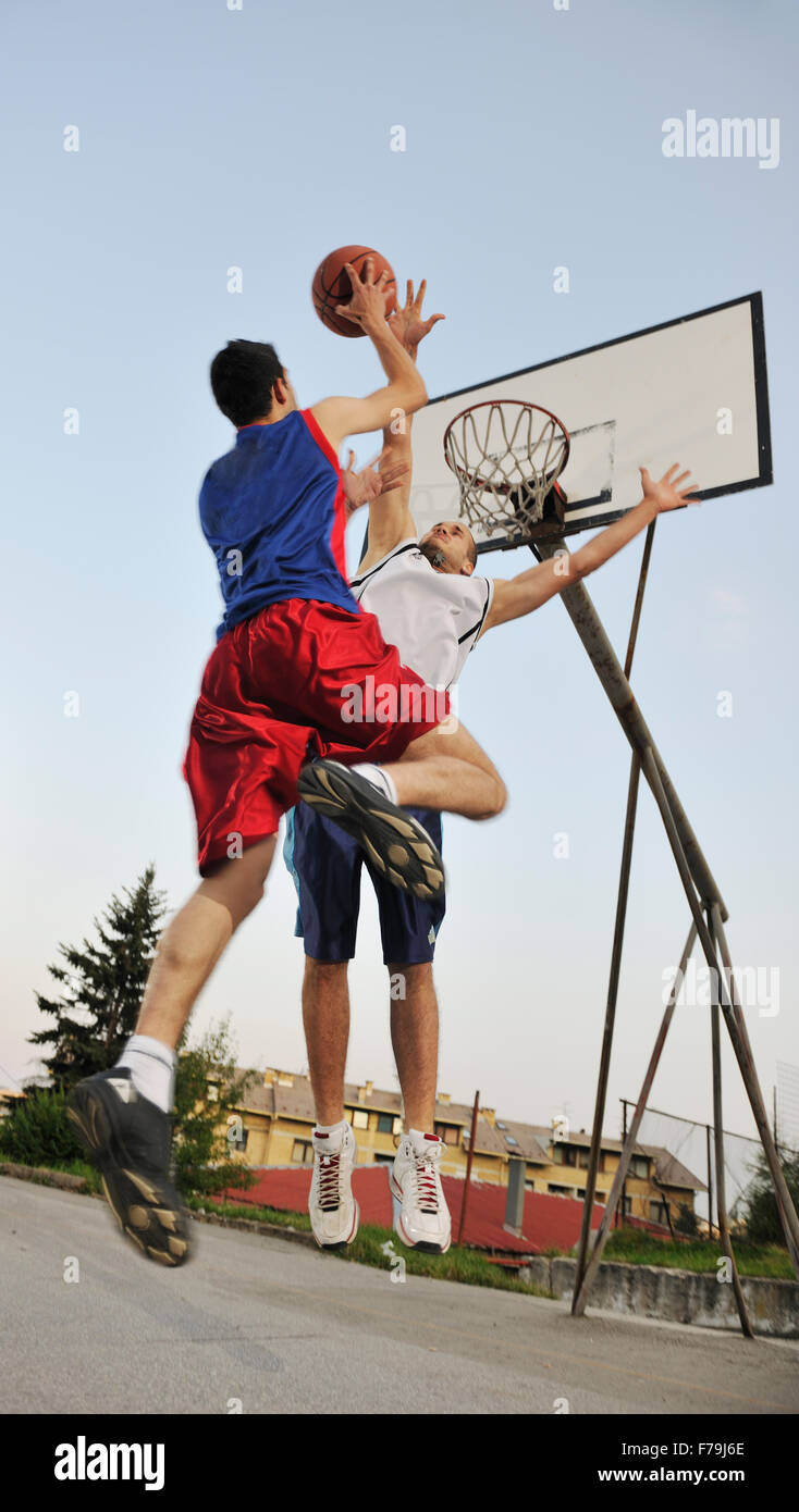streetball basketball game with two young player at early morning on ...