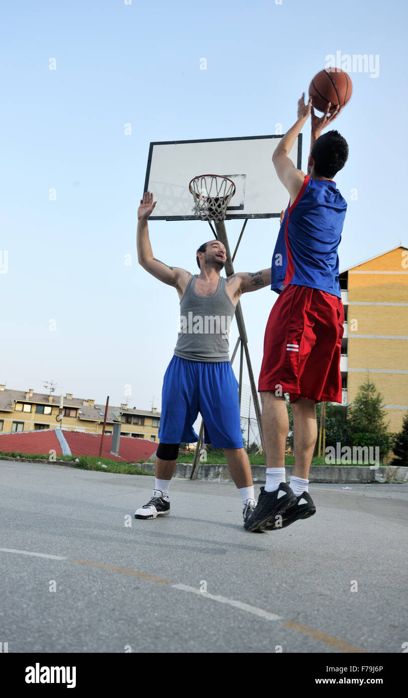 streetball basketball game with two young player at early morning on ...