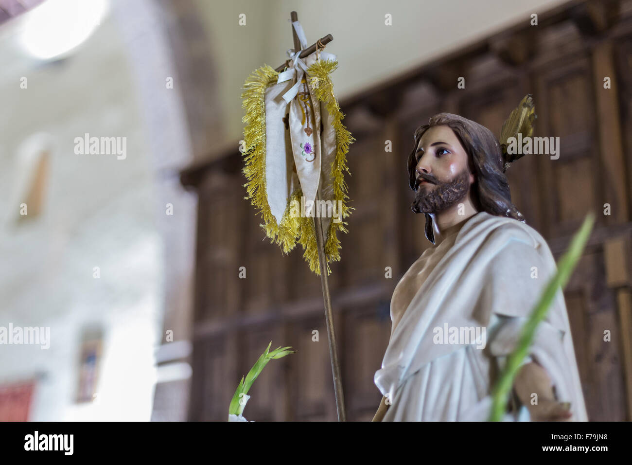 Jesus figure inside a church at night Stock Photo - Alamy