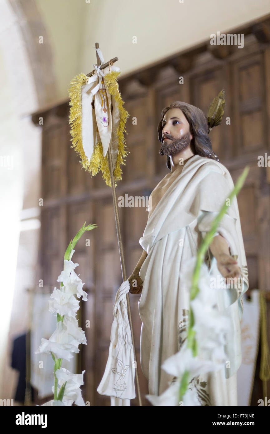 Jesus figure inside a church at night Stock Photo - Alamy