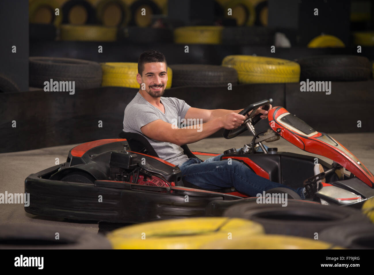 Young Man Is Driving Go-Kart Car With Speed In A Playground Racing ...