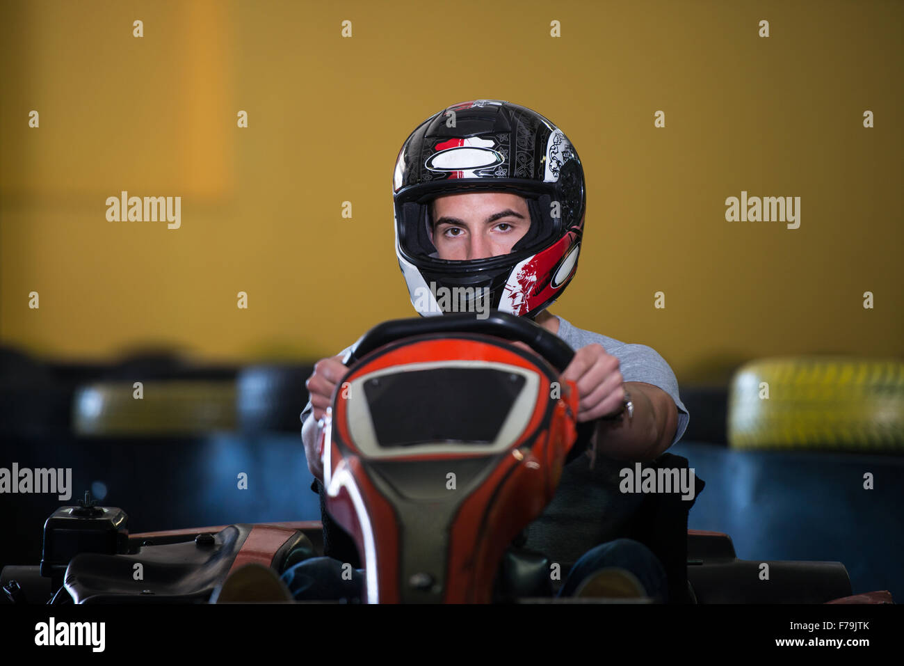 Young Man Is Driving Go-Kart Car With Speed In A Playground Racing ...